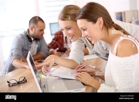 Babe Girls In Class Studying On Laptop Computer Stock Photo Alamy