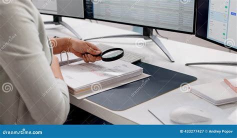 Auditor With Magnifying Glass Checking Financial Report Stock