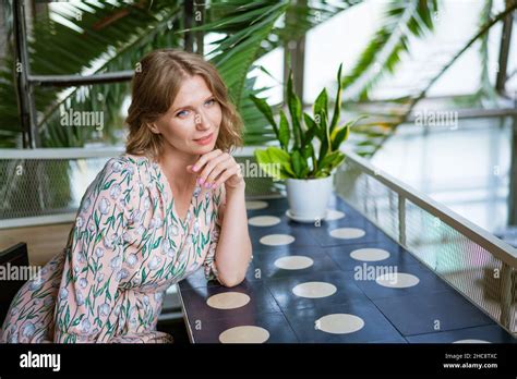 Portrait Charming Woman Is Calling Sitting Alone In Cafe In Her Free