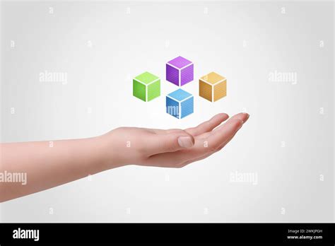 Hand Holding Levitating Blockchain Cubes With Binary Code Symbolizing Digital Empowerment And