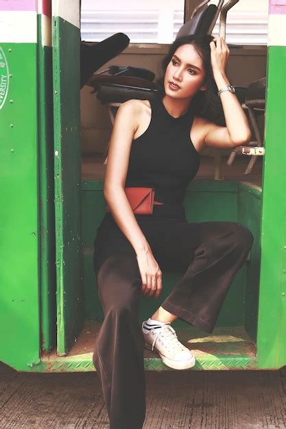 Premium Photo Young Woman Looking Away While Sitting In Bus