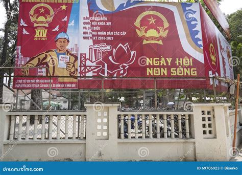 Political Propaganda Banner Hangs On The Facade Of A Humble Working