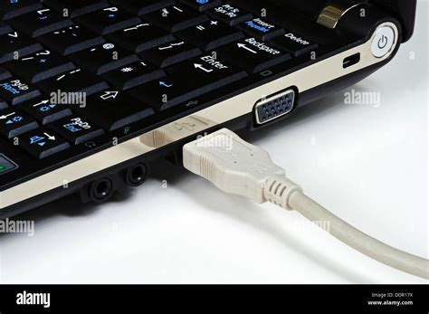 USB Cable Plugged Into Side Of Netbook Stock Photo Alamy