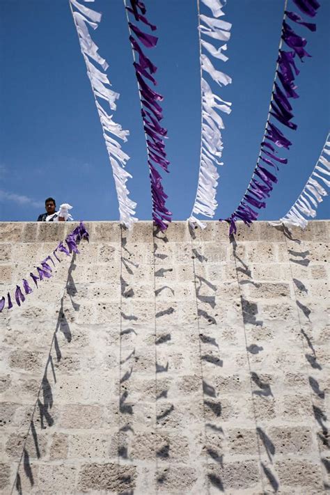 Man Assembling The Decoration For Catholic Celebrations At The Top Of