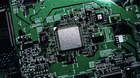 Macro Close Up Shot Of Microchip Cpu Processor On Black Printed Circuit Board Computer