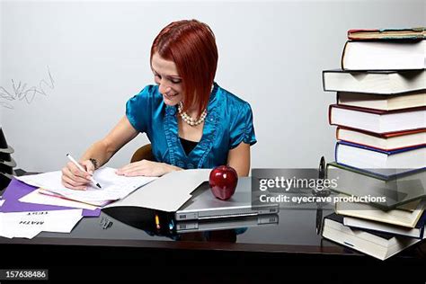 Teacher Grading Papers Photos And Premium High Res Pictures Getty Images