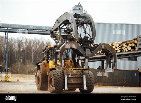Front Loader For Loading Timber An Industrial Tractor Transports