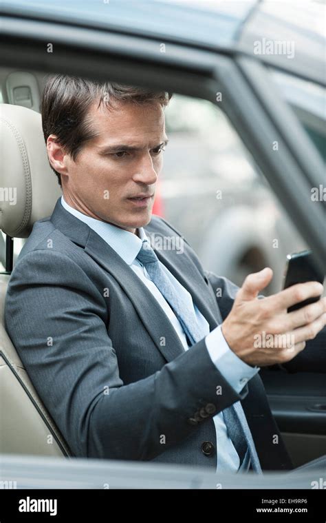 Man Reading Text Message While Driving Stock Photo Alamy