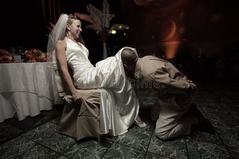 Groom Removing The Garter Stock Photo Image Of People 11999368