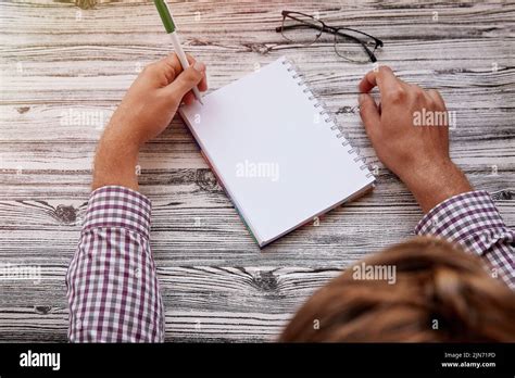Man Writing In Notepad Mock Up Using His Left Hand Conceptual Photo Of Lefthanded Day Copy