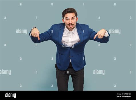 Angry Man With Mustache Standing Pointing Down Giving Command Looking At Camera With Serious