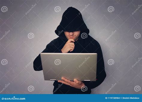 Cybercrime Hacking And Technology Crime Male Hacker In Dark Room With Laptop Computer Hacker