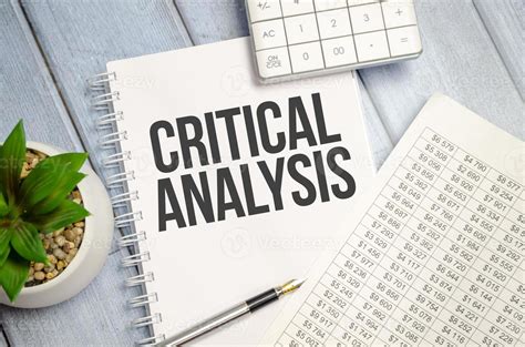 Critical Analysis Word On Notepad With Glasses And Chart 11649186 Stock