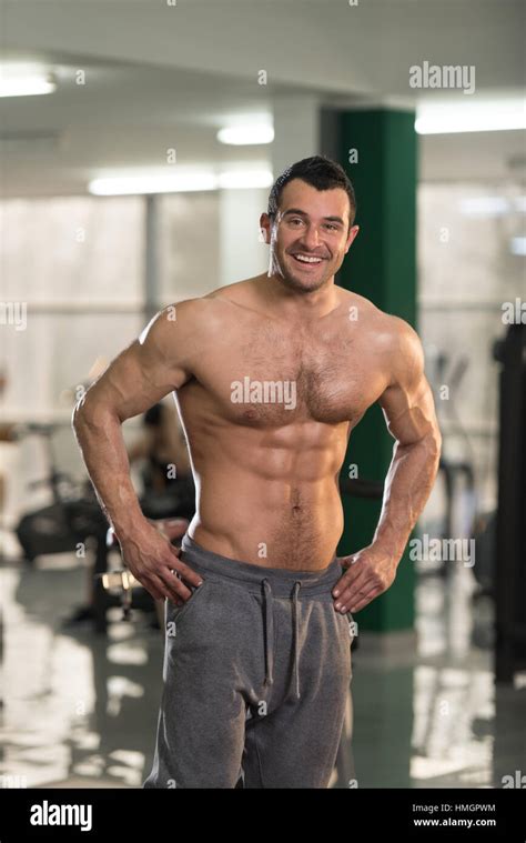 Portrait Of A Young Physically Fit Hairy Man Showing His Well Trained