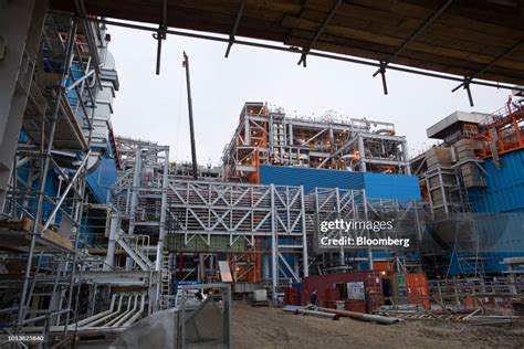 A Worker Operates At One Of The Liquefied Natural Gas Facilities At