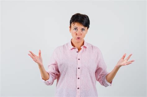 Free Photo Female Trying To Clarify Problem In Pink Shirt And Looking