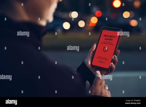 security alert on smartphone screen antivirus warning private data