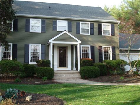 Olive Greenhouse Exterior With Black Shutters