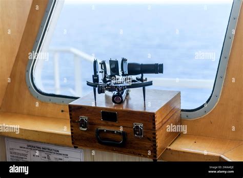 Nautical Black Sextant Placed On Wooden Box In Navigational Bridge Navigational Equipment