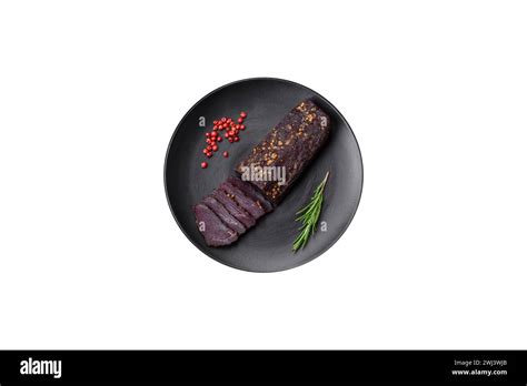 Delicious smoked Armenian basturma with spices and herbs Stock Photo ...