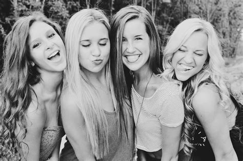 Download Four Girls Are Smiling And Laughing In Black And White Wallpapers Com