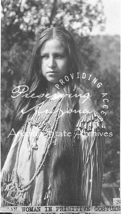White Mountain Apache Woman Wearing An Elaborate Fringed Outfit In