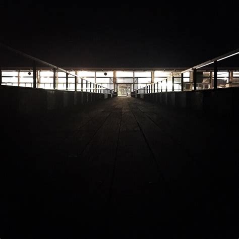 Premium Photo Walkway Leading Towards Exit In Building