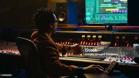 Tracking Engineer Processing And Mixing Sounds In Control Room Stock