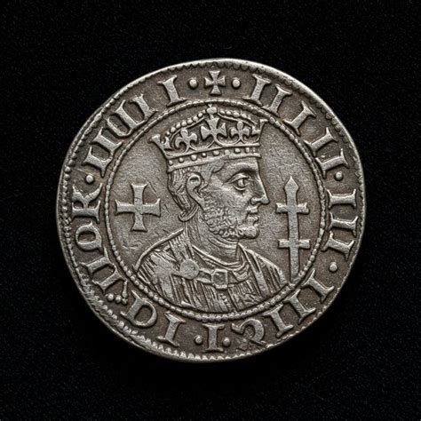 A Detailed Ancient Coin Featuring A Portrait Of A Crowned Figure With A