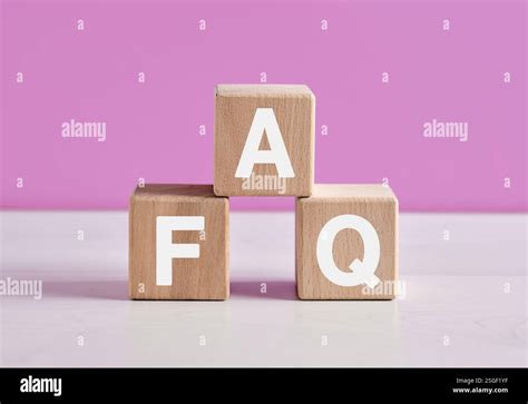 Three Wooden Cubes With White Letters Forming The Acronym Faq Frequently Asked Questions Stock