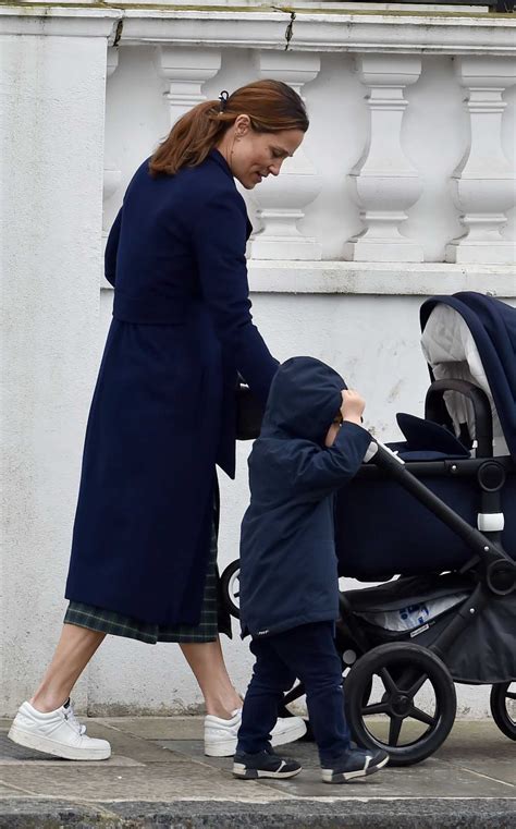 Pippa Middleton In A Blue Coat Pushing Newborn Daughter Grace In Her