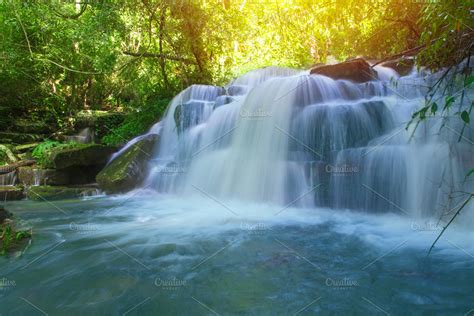 Pretty Tropical Rainforest With Waterfall