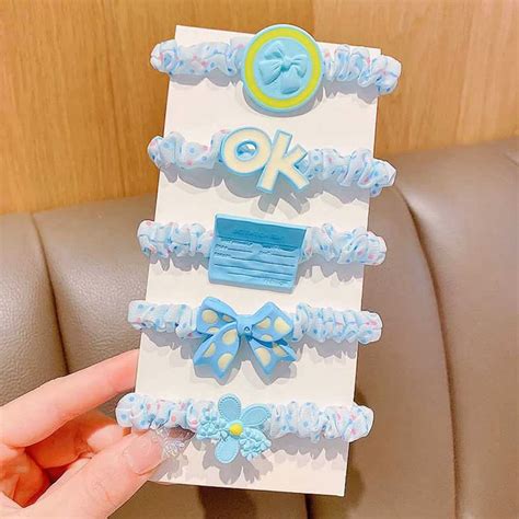 قیمت و خرید کش مو زنانه مدل پلیسه عروسکی سیلیکونی مجموعه 5 عددی