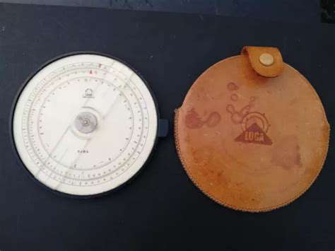 A Vintage Loga Swiss Circular Slide Rule Leather Case £1599