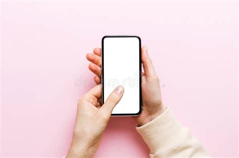 Top View Of Woman Hands Holding Smart Phone With Blank Copy Space