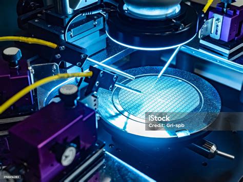 Close Up Of Examining Of Test Sample Of Microchip Transistor Under The Microscope In Laboratory