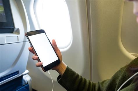 Premium Photo Woman Using Cellphone Inside Airplane