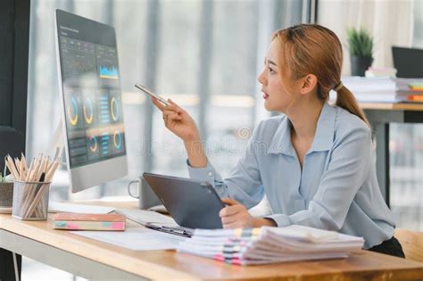 The Female Analyst Utilizes A Computer And A Dashboard For Business Data Analyze And A Data