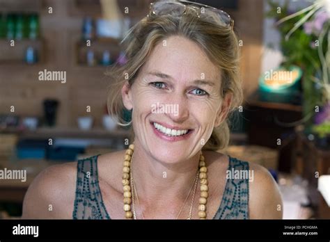 Portrait Of French Blonde Mature Woman Smiling In Her Handmade Ts