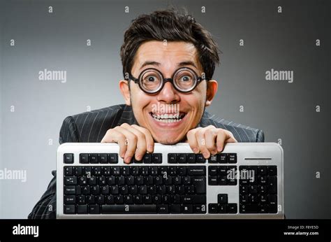 Computer Geek With Computer Keyboard Stock Photo Alamy