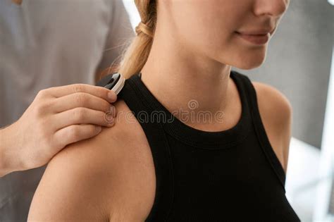 Specialist Conducts A Hardware Therapy Session In A Wellness Center