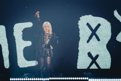 Avril Lavigne Shows Off Pop Punk Style In Edgy Fishnet Top