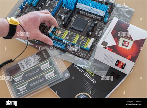Brand New Computer Motherboard With Anti Static Equipped Engineers Hand About To Carry Out
