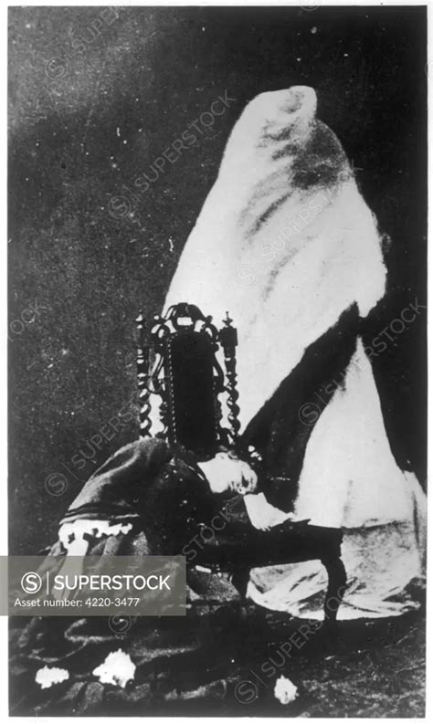 Florence Cook Lies In Trance With A Spirit Form Behind Her During A Seance At The Home Of Sir