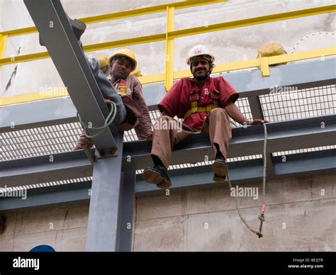 Indian Construction Workers Assembling A Factory Building In An Industrial Area Of India In