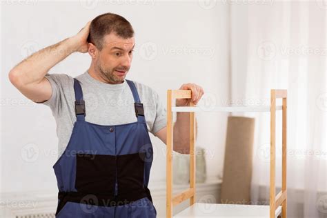 Furniture Assembly Problem Puzzled Repairman Scratching Head Assembling Cabinet Without