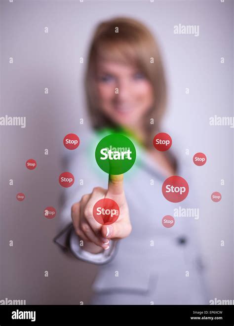 Woman Pressing Start Button Stock Photo Alamy