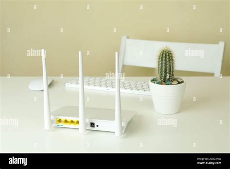 Workplace With Wi Fi Router On White Table Stock Photo Alamy