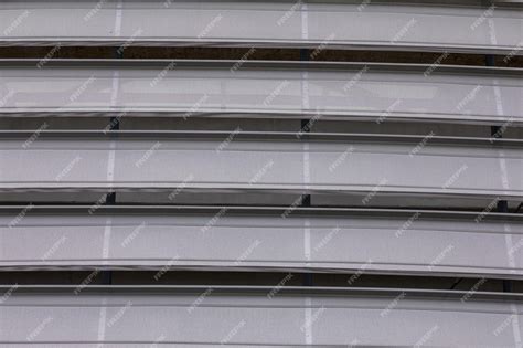 Premium Photo A Fragment Of The Buildings Facade Consisting Of Openwork Metal Panels