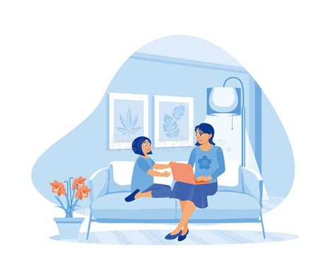 Mother And Daughter Sitting On The Sofa They Have Fun And Use The